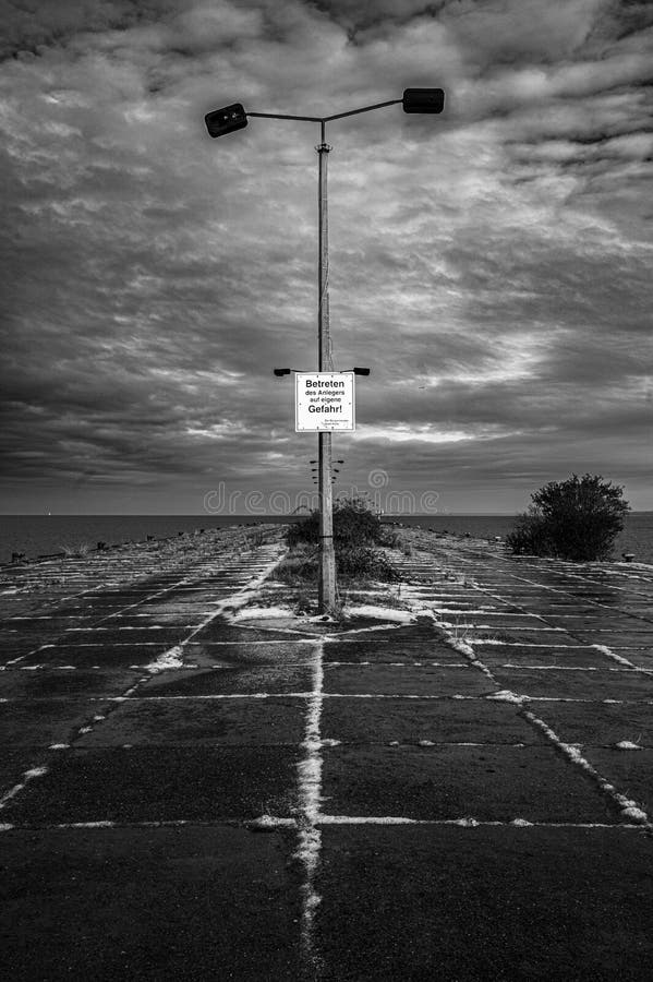 Vertical Shot of a Sign in German in an Empty Road Stock Image - Image ...