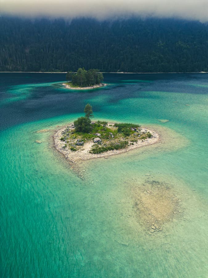 Vertical Shot of the Small Peninsula in the Middle of the Lake with Fir ...