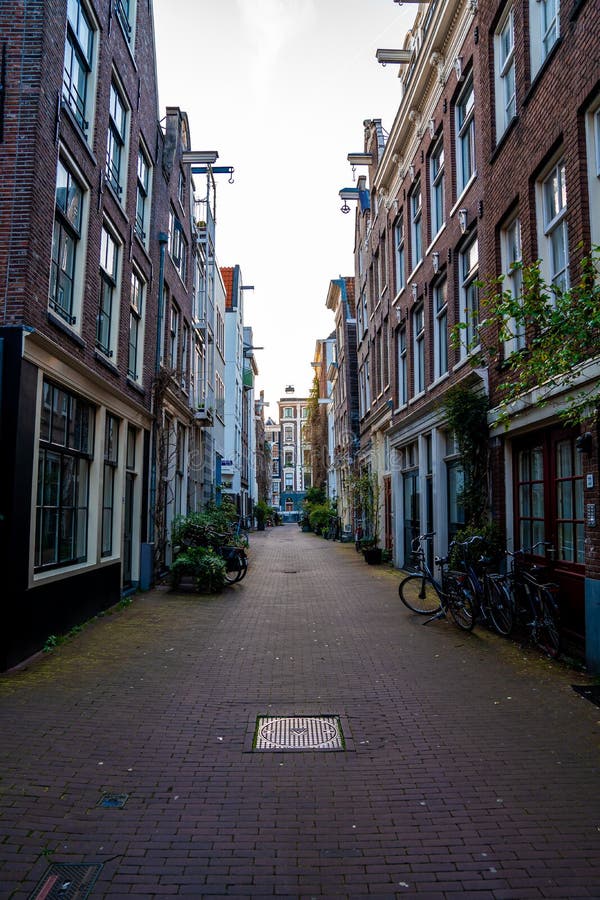 Vertical Shot of a Small Stone Alley in Amsterdam on a Bright Day Stock ...