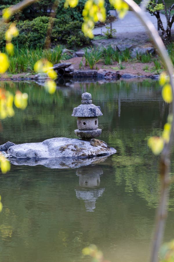 Vertical Shot of a Small Stone Structure on the Lake in a Japanese ...