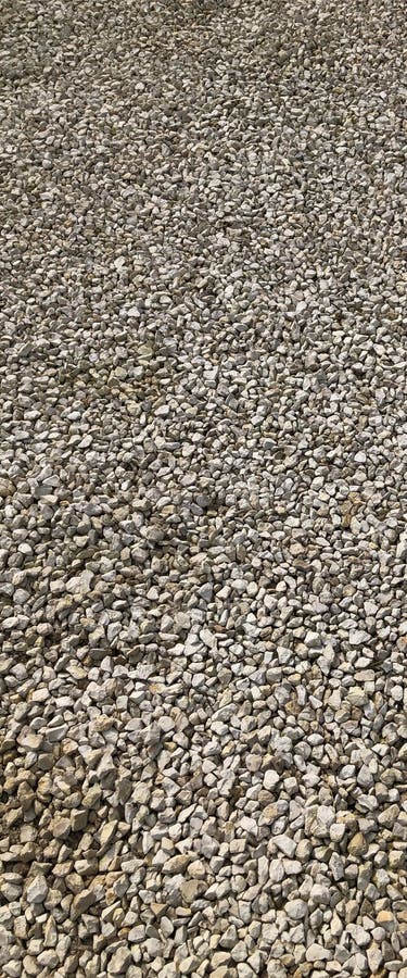 Vertical Shot of Small White Pebbles on the Ground Stock Image - Image ...