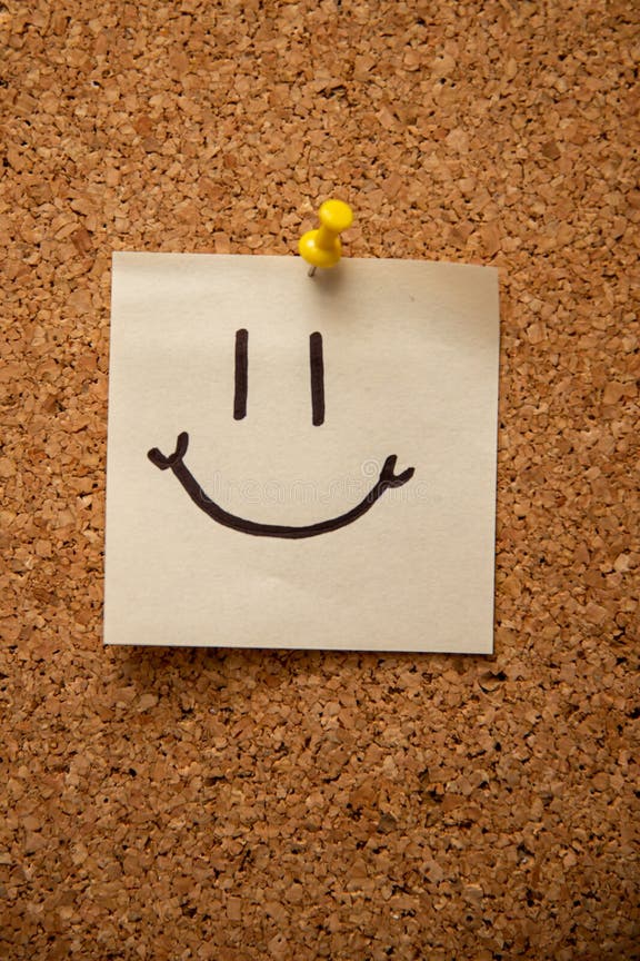 Vertical Shot of a Smiley Face on an Attached Sticky Note Stock Image ...