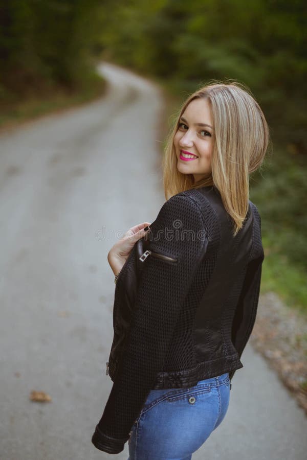 Vertical Shot of a Smiling Caucasian Female in a Cool Leather Jacket ...
