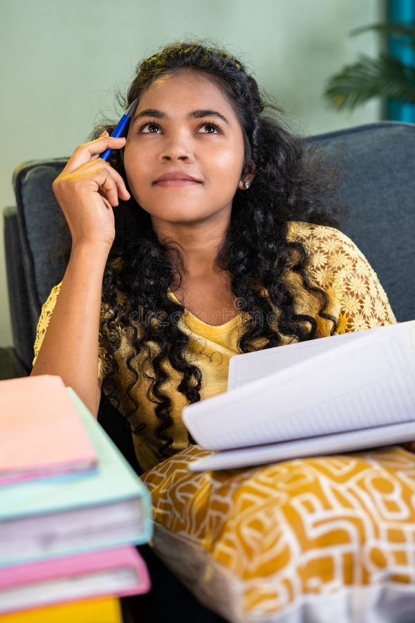 Vertical Shot of Smiling Thoughful Girl while Writing Book at Home ...