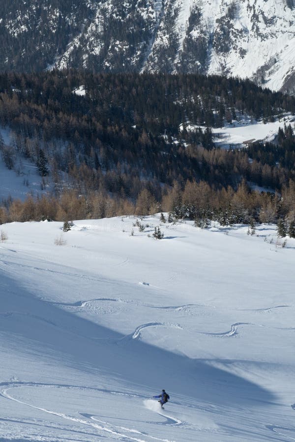 Vertical Shot of a Snowboarding Man in Snowy Mountains Stock Image ...