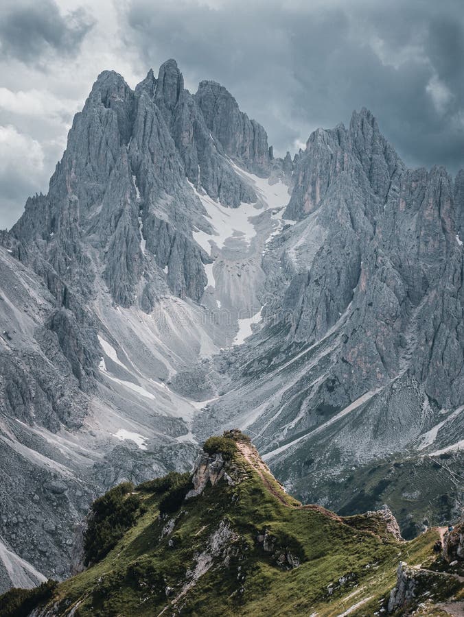 Vertical Shot of Snowy Alps on a Cloudy Day Stock Photo - Image of hill ...