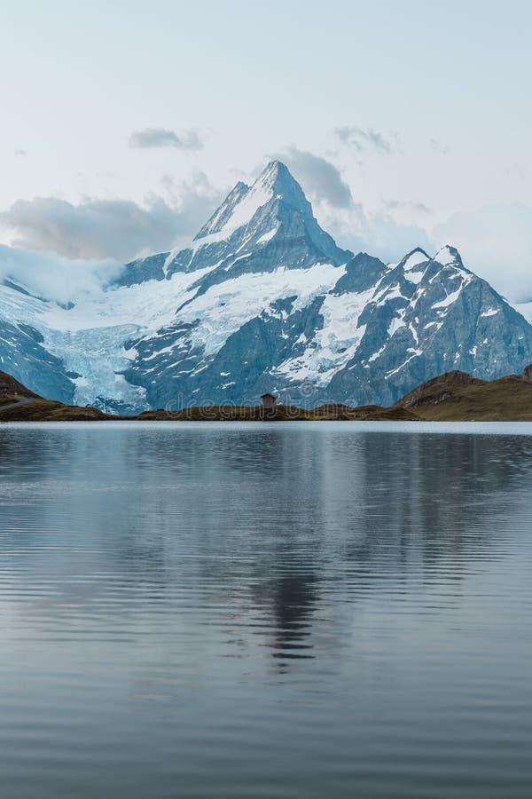Vertical Shot of a Snowy Mountain Range and the Tranquil Bachalpsee ...