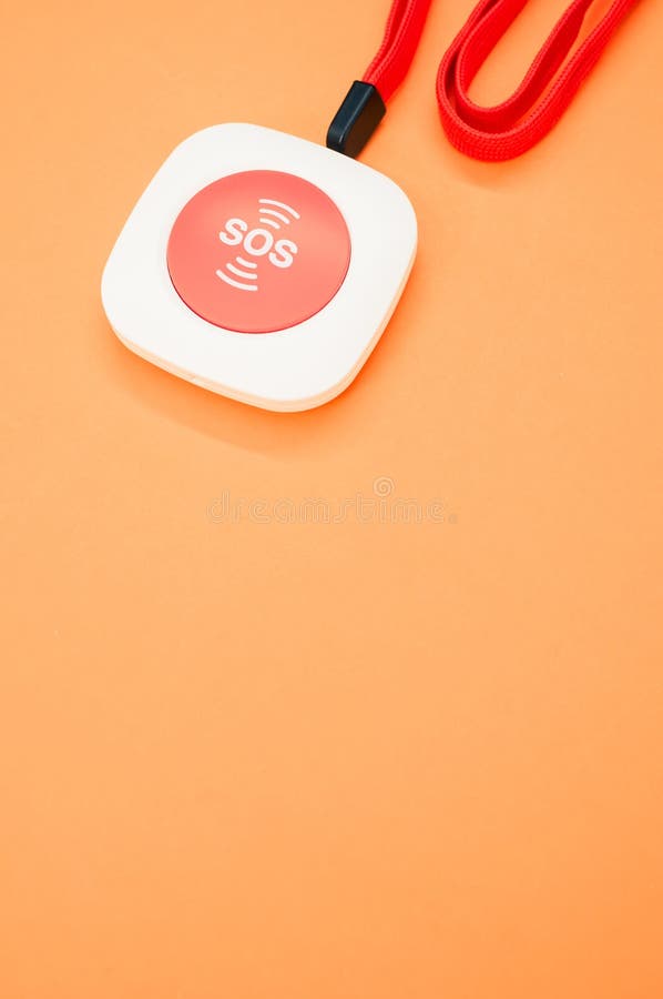Vertical Shot of an SOS Button on a String, Placed on an Orange Surface ...
