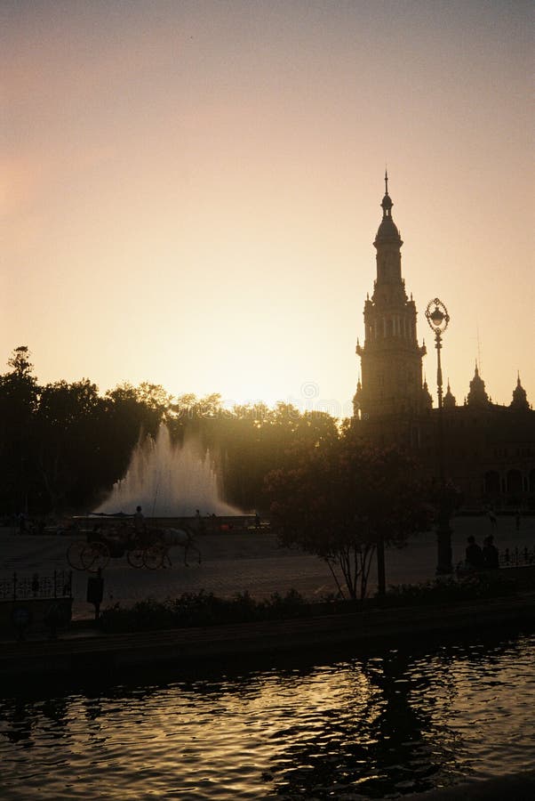 Vertical Shot of the Spain Square Surrounded by Green Trees Under the ...
