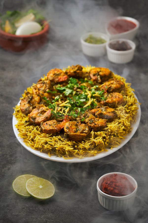 Vertical Shot of Spicy Rice and Fried Meat on a Plate and Different ...