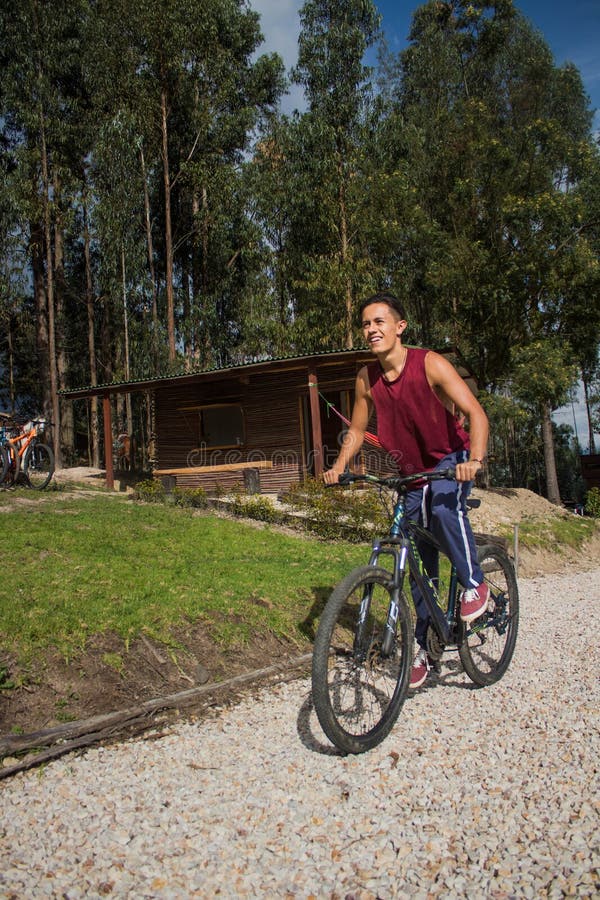 Vertical Shot of a Sporty Man Riding a Bicycle in the Park Stock Photo ...
