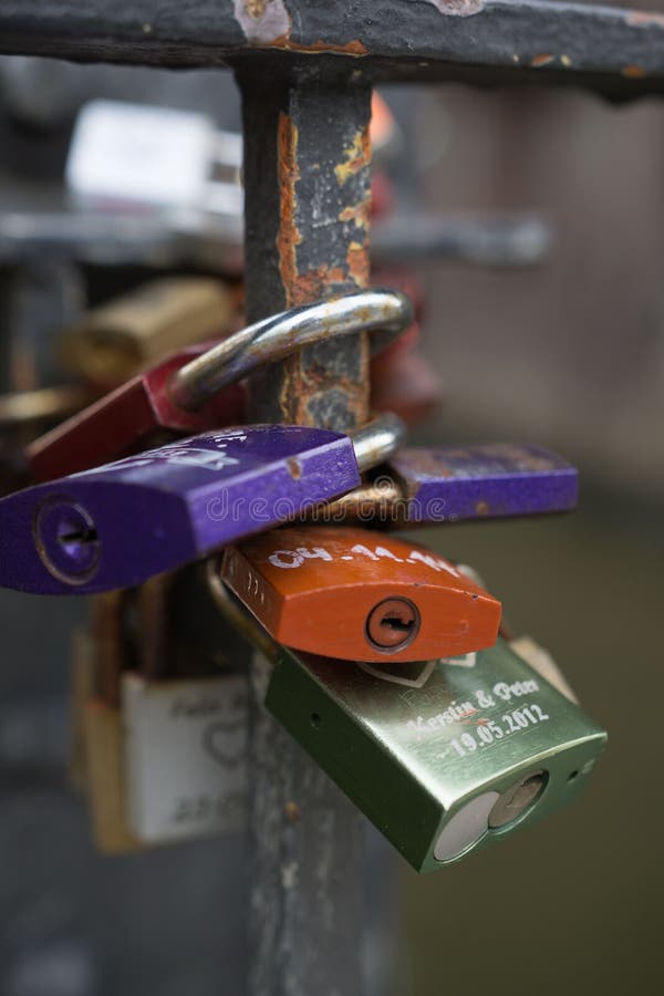 Vertical Shot of a Stack of Love Locks Attached To the Railing of a ...