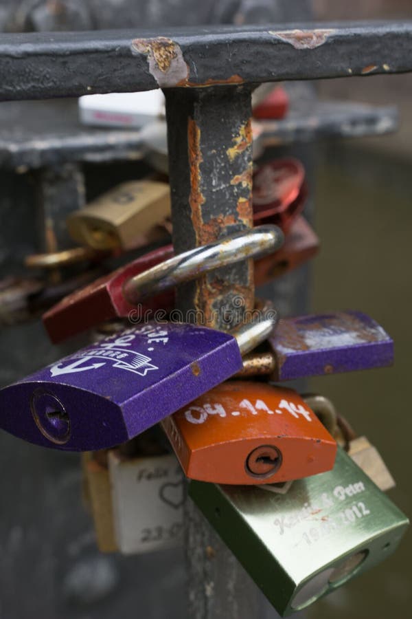 Vertical Shot of a Stack of Love Locks Attached To the Railing of a ...