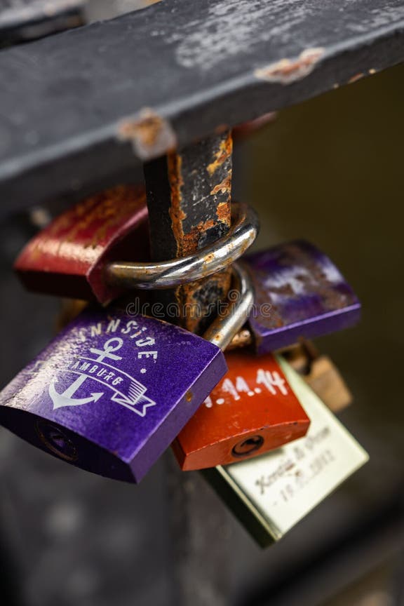 Vertical Shot of a Stack of Love Locks Attached To the Railing of a ...