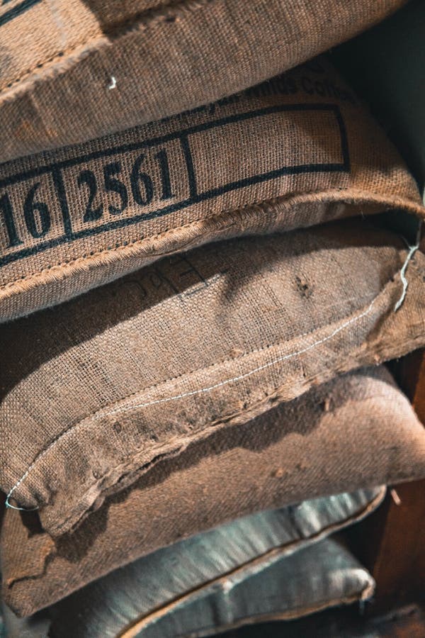 Vertical Shot of a Stack of Sacks with Coffee Stock Photo - Image of ...