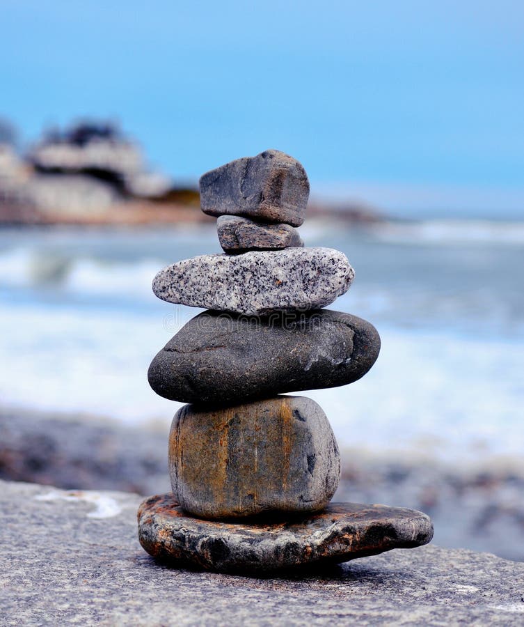 Vertical Shot of a Stack of Stones on a Concrete Surface Stock Image ...