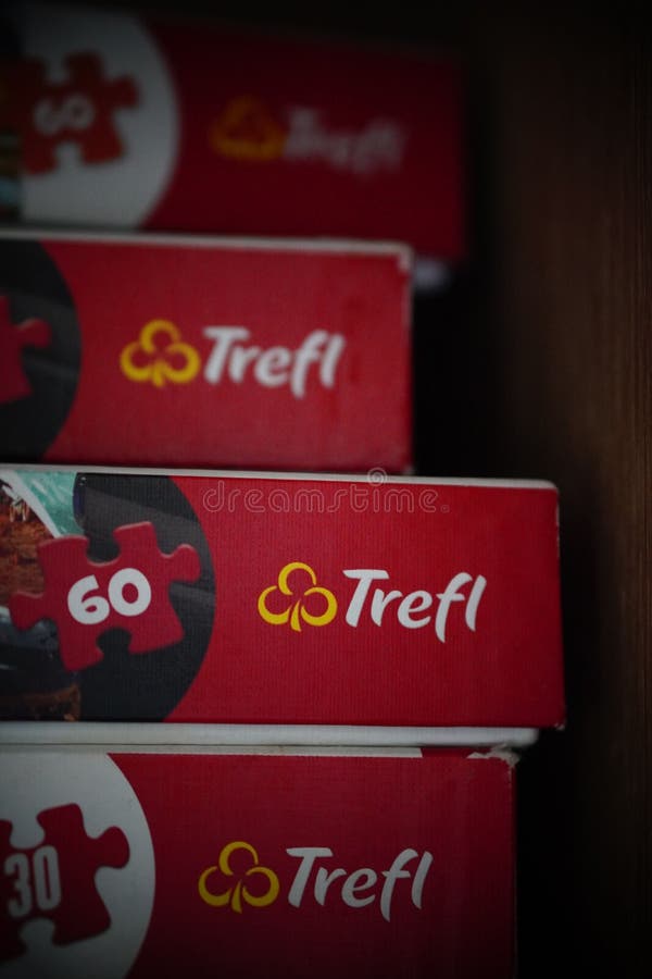 Vertical Shot of a Stack of Trefl Brand Puzzle Boxes on a Shelf ...