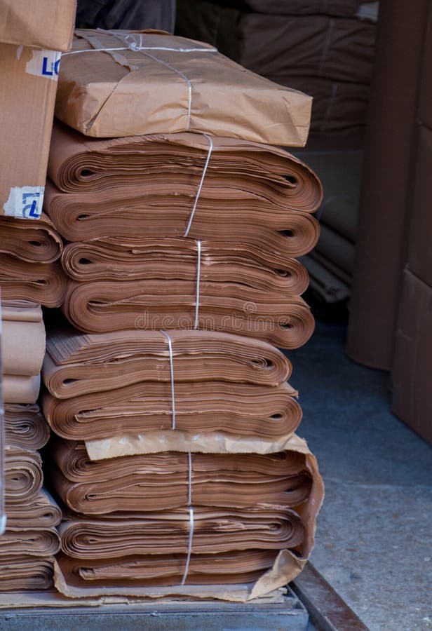 Vertical Shot of Stacked Craft Paper Rolls on the Ground Under the ...