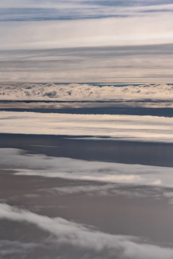 Vertical Shot of the Stacks of Clouds and the Sun Seen from an Airplane ...