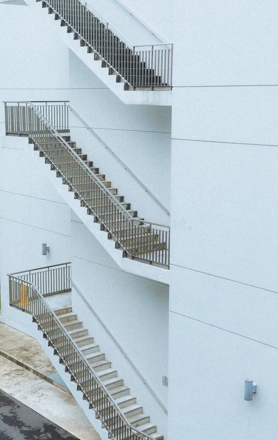 Vertical Shot of Stairs Attached To a White Building Stock Image ...