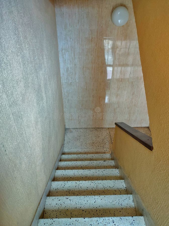 Vertical Shot of Stairs with Marble Wall and Tiles Inside a Building ...