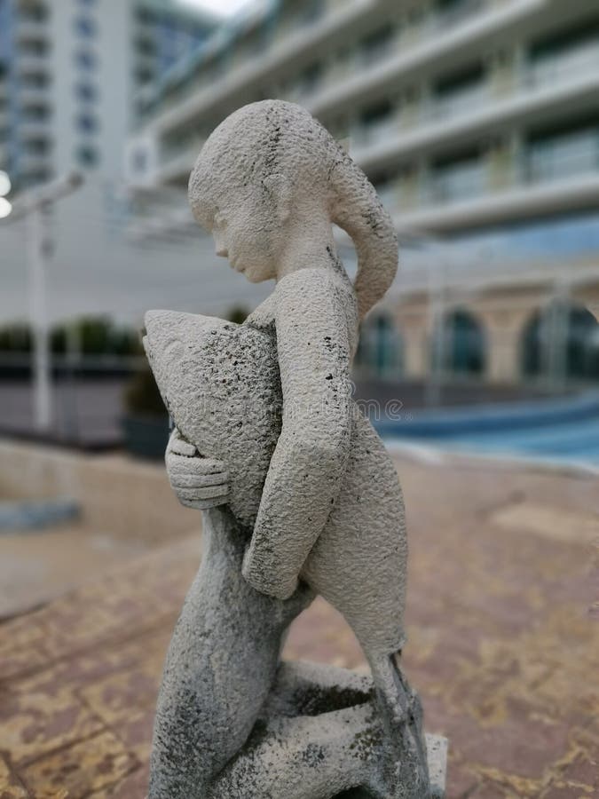 Statue of the Girl in the Facade of the Historic Building Stock Photo ...