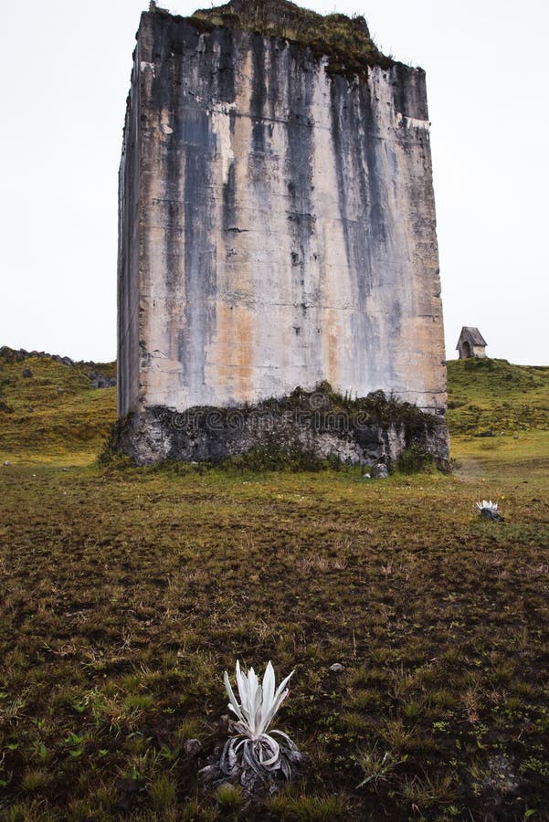 Vertical Shot of Steep Rectangular Rock Formation in the Green Field ...