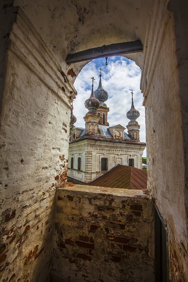 Vertical Shot of a Stone Arc Window in an Old Building Overlooking an ...