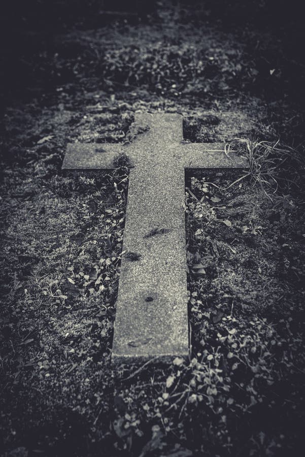 Vertical Shot of a Stone Cross on the Ground in Grey Stock Image ...
