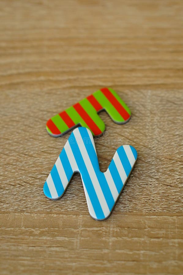 Vertical Shot of Striped Words on a Wooden Surface Stock Image - Image ...