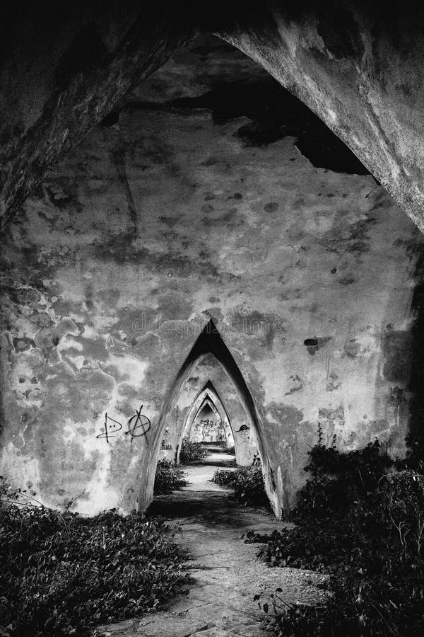 Vertical Shot of Structures with Arches Under a Highway with Graffitis ...