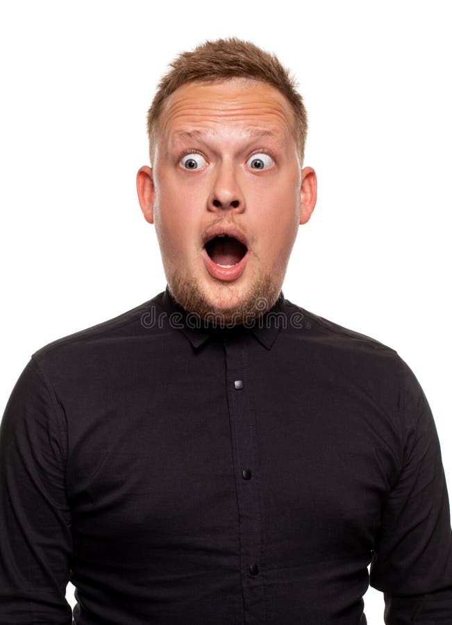 Vertical Shot of Stupefied Stunned Shocked Young Male Keeps Mouth ... Vertical Shot of Stupefied Stunned Shocked Young Male Keeps Mouth ...