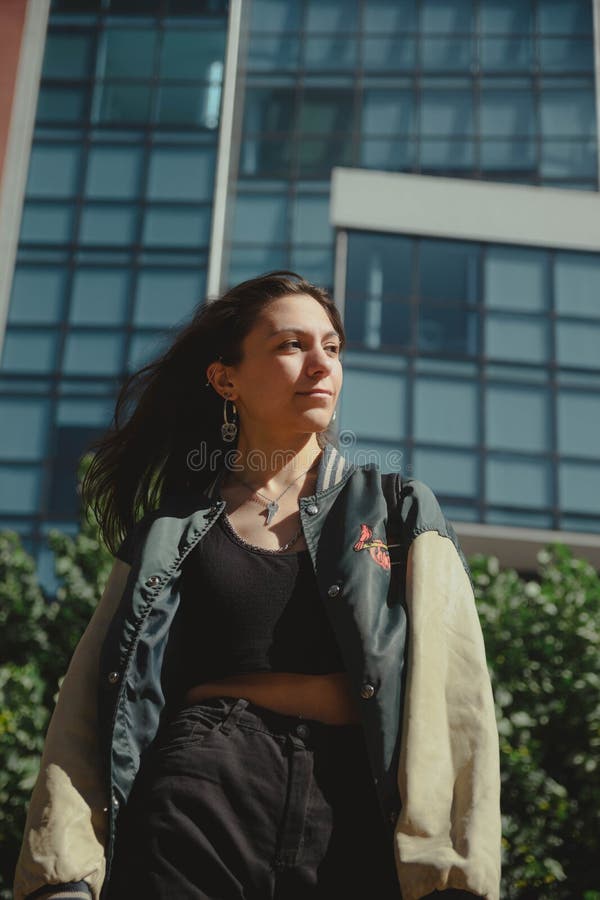 Vertical Shot of a Stylish Female Standing Outside Stock Photo - Image ...