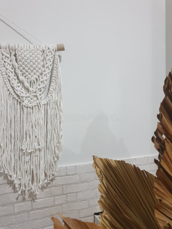 Vertical Shot of a Stylish Macrame on a White Wall Stock Image - Image ...