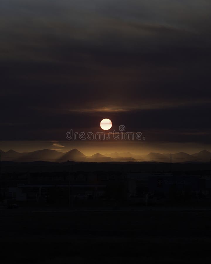 Vertical Shot of the Sun Glowing in the Darkness. Stock Image - Image ...