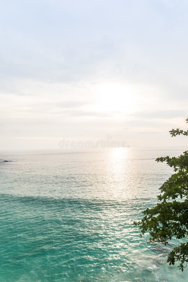 Vertical Shot of the Sun Rising Over the Ocean Bringing Joy and ...