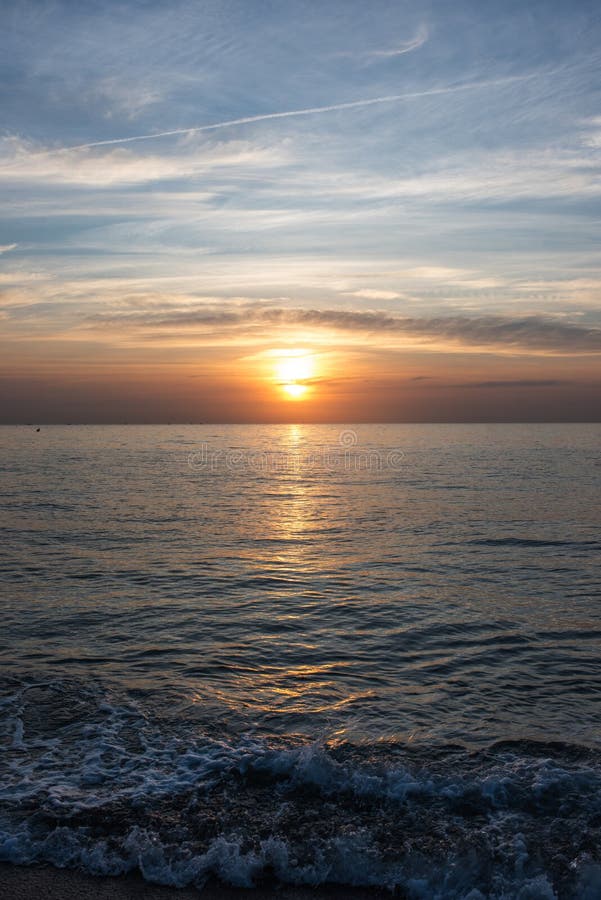 Silhouette of Lighthouse and a Yacht during Sunset Near Cape Henlopen ...