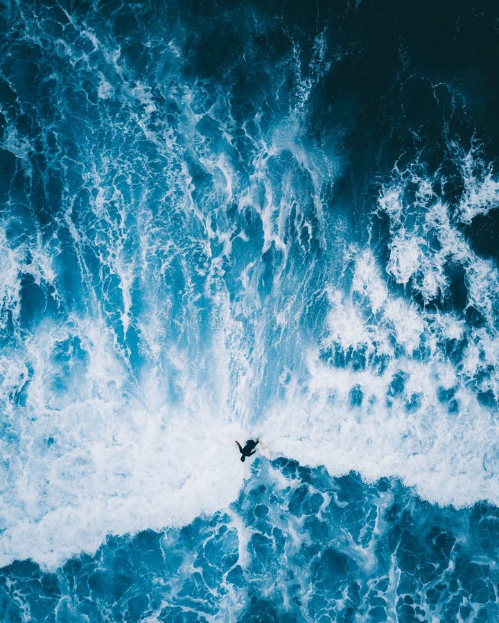 Vertical Shot of a Surfer in Wavy Se Stock Photo - Image of water ...