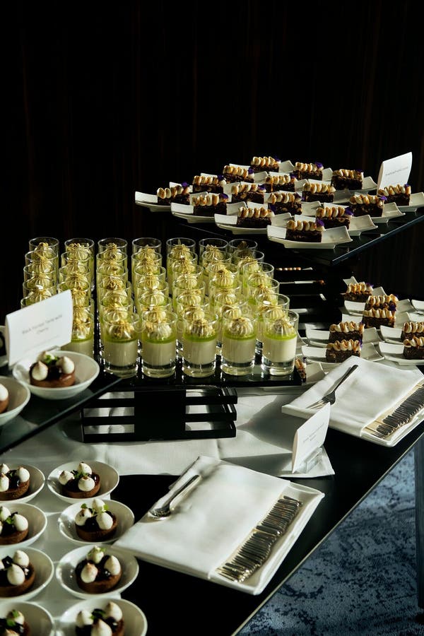 Vertical Shot of a Sweet Buffet Table with Utensils Stock Photo - Image ...