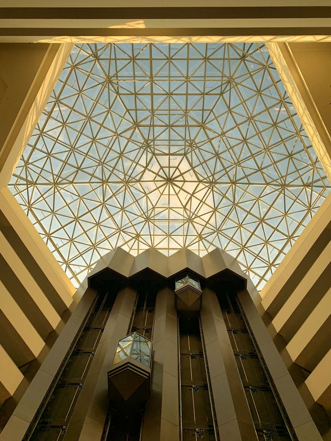 Vertical Shot of a Symmetrical Pentagon-shaped Ceiling with a Cloudy ...