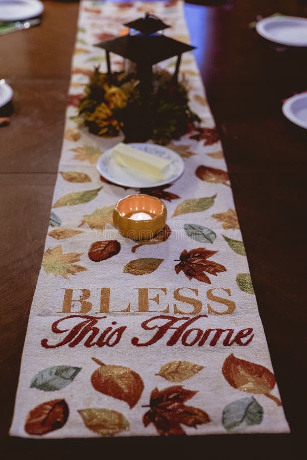 Vertical Shot of a Table Runner with Bless the Home Written on it Stock ...