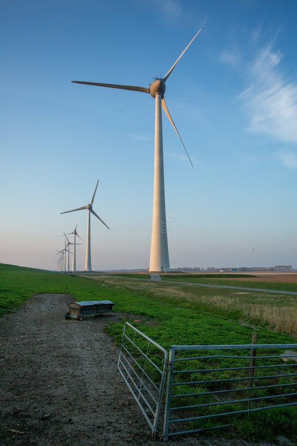 Tall Wind-turbines with Blue Sky in the Background Along the ...