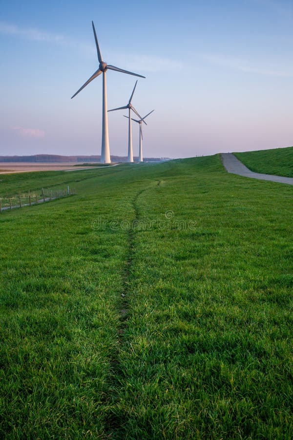 Tall Wind-turbines with Blue Sky in the Background Along the ...