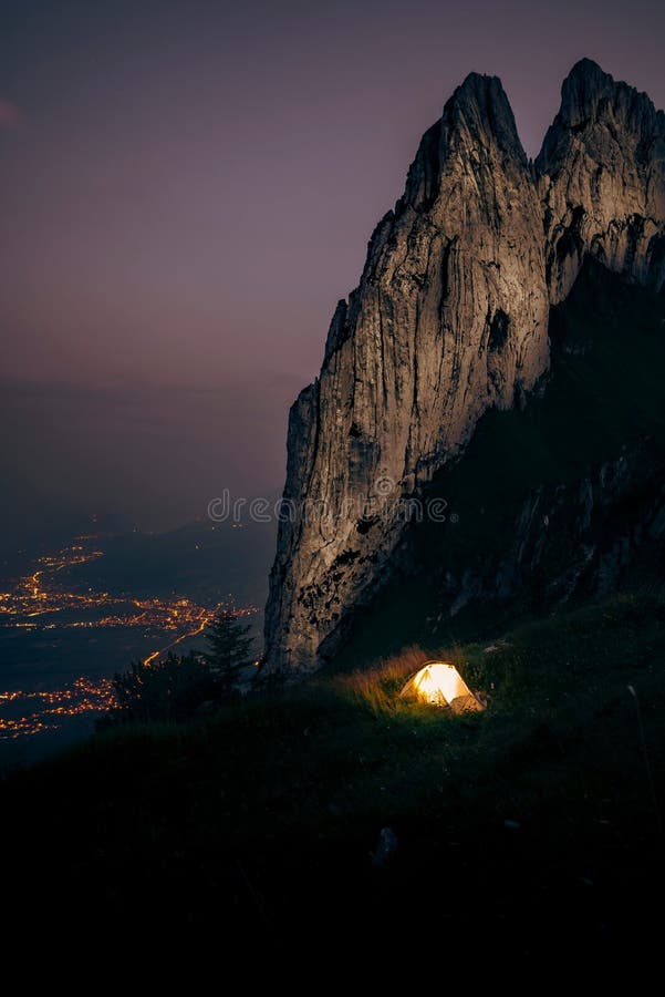 Vertical Shot of a Tent Illuminated from Inside in the Mountains at ...