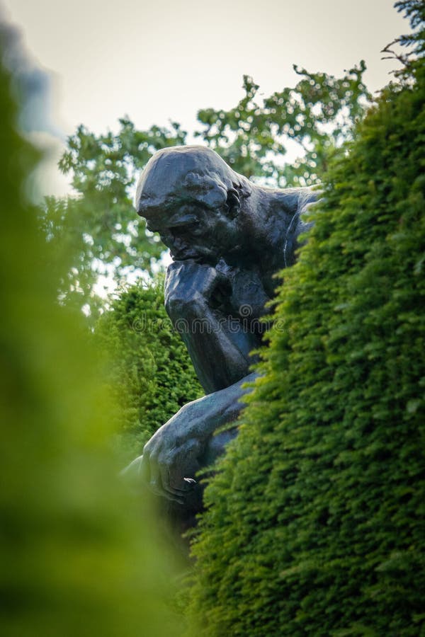Vertical Shot of the Thinker Statue Surrounded by Green Trees in Paris ...