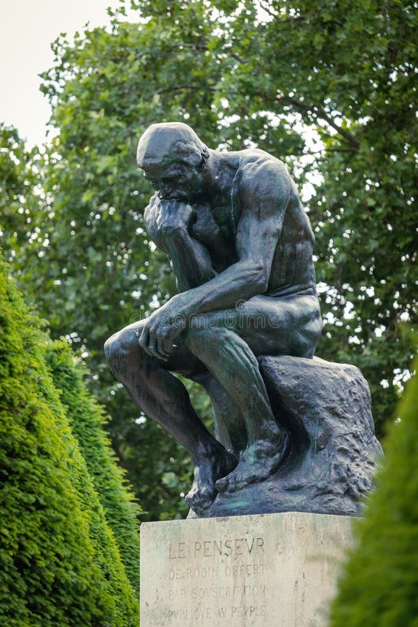 Vertical Shot of the Thinker Statue Surrounded by Green Trees in Paris ...