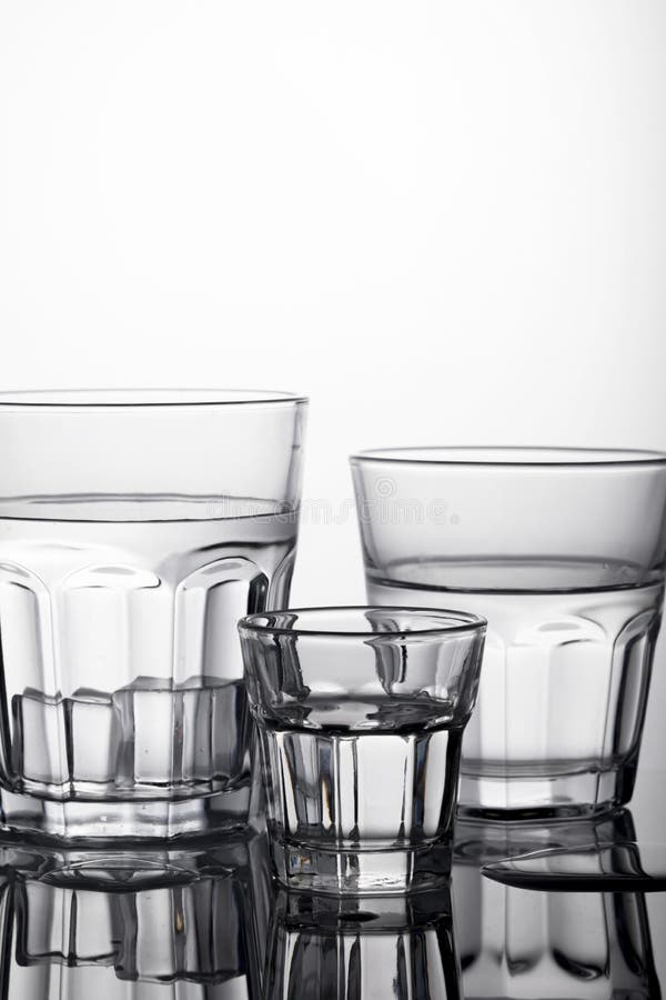 Vertical Shot of Three Old-fashioned Rocks Glass Filled with Water on ...