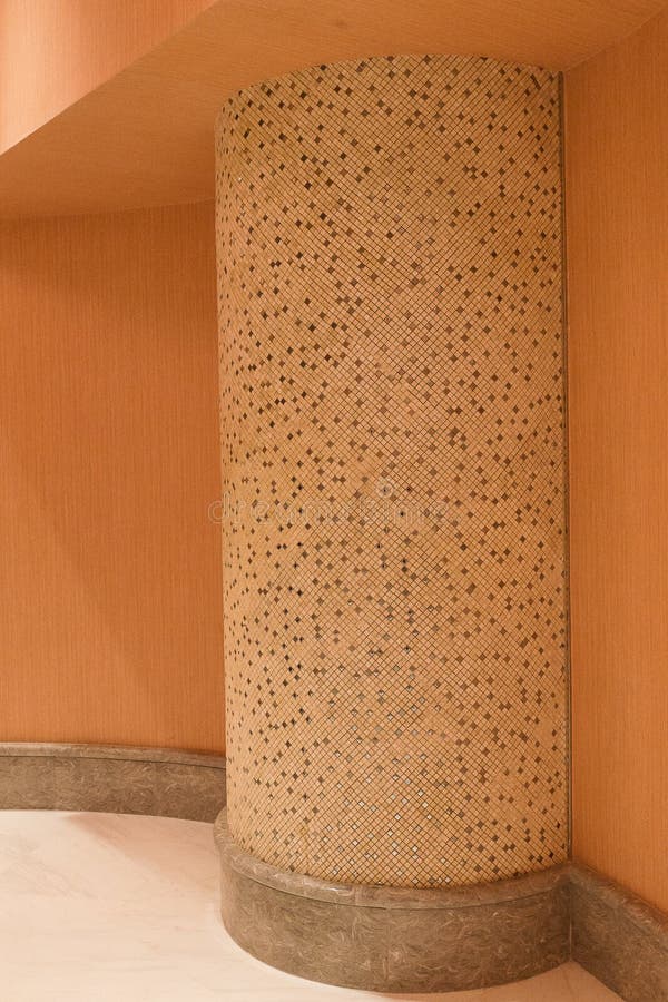 Vertical Shot of a Tiled Column on an Orange Wall in a Building Stock ...