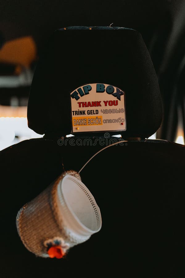 Vertical Shot of Tip Cup on the Back Seat of a Cab Stock Image - Image ...