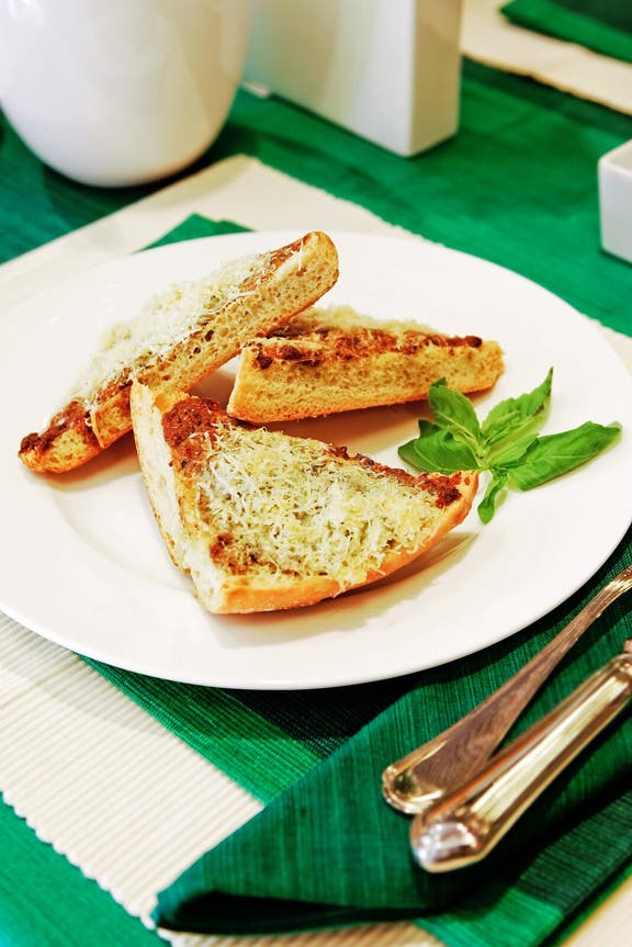Vertical Shot of Toasted Bread with Cheese on a Plate Stock Image ...